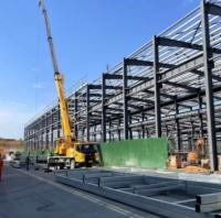 China Prefabricated bolt‑assembled steel‑frame building industrial workshop logistics warehouse plant with crane beam mezzanine floor skylight and drainage system for industrial construction for sale