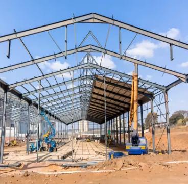 China Prefabricated Steel Structure Warehouse Q355B Galvanized Frame Industrial Plant Shed 30m Span for sale
