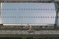 China Pre‑manufactured steel frame components field installation factory building food‑processing plant stock warehouse transit logistics station for sale