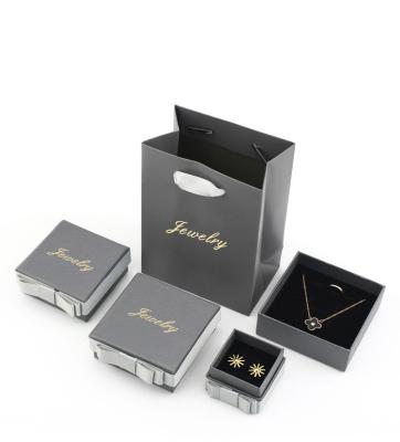 China Gray Bow Specialty Hard Paper Packing Jewelry Boxes For Earrings Ring Gift Box for sale