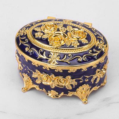 China Gold Blue Rose Enamel Oval Metal Jewelry Storage Organizer Box Compact Size 8.9x5.9cm For Weddings, Anniversaries for sale