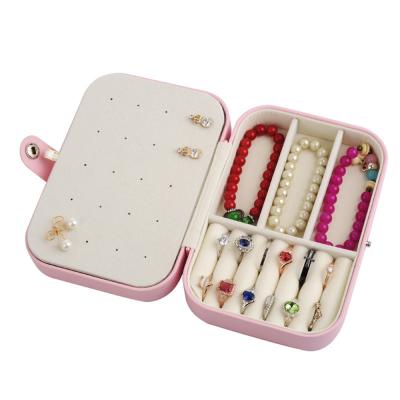 China Durable Pink Travel Jewelry Storage Box Compact and Secure Portable Storage for Necklaces Rings Earrings for sale