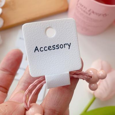 China Embossed Hair Tie Folding Cards Black Text 100pcs for sale