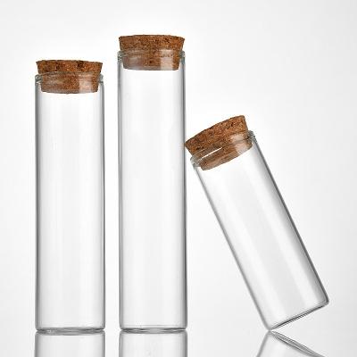 China Transparent Glass Storage Bottle Cylinder Glass Cosmetic Bottle With Stopper for sale
