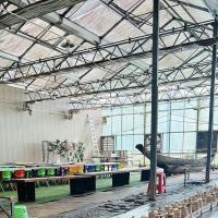 China Glass Greenhouse with Hydroponic System Durable Glass Cover and Affordable Shipping for sale