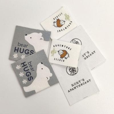China Custom Embroidered Cotton Clothing Labels for Baby Garments - 1000pcs MOQ with 6 Folding Styles for sale