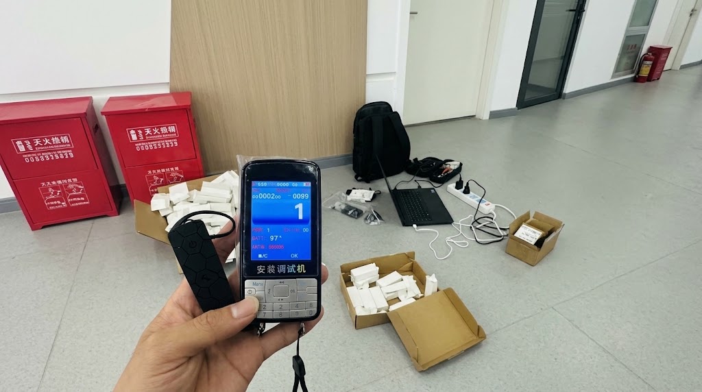 Staff preparing audio guide devices