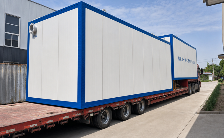 Numbered wastewater treatment modules secured on a low-bed trailer