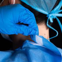 China Reinforced Disposable SMS Surgical Gowns With Knitted Wrist For Operating Room for sale