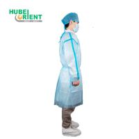 China Blue/White Waterproof Disposable PP PE Medical Isolation Gown With Blue Tape for sale