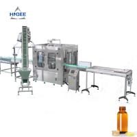 China Pharmaceutical 30ml 60ml 100ml glass bottle syrup liquid filling capping machine with self-adhesive labeling machine for sale