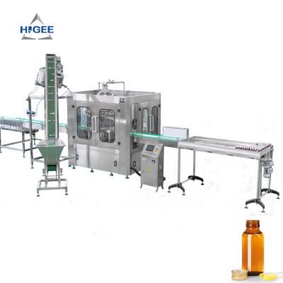 China Pharmaceutical 30ml 60ml 100ml glass bottle syrup liquid filling capping machine with self-adhesive labeling machine for sale