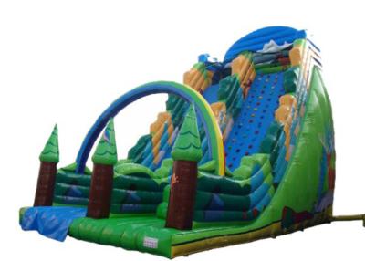 China Green Forest Theme Blow Up Slide , Giant Inflatable Slide With Climbing Wall for sale