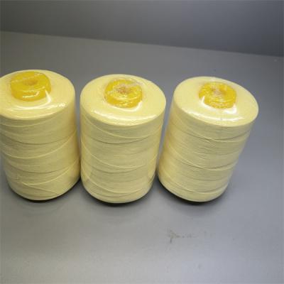 China 90TEX Para Aramid Raw Yellow Sewing Thread Ne20/3 2000m Cone Heat Resistant Industrial Grade for sale