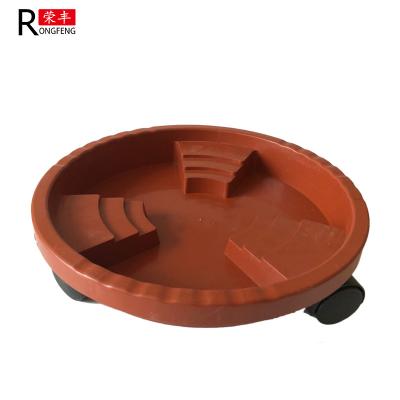 China Circular Plastic Flower Pot Trays with Rollers in 26cm to 50cm Sizes | Eco-Friendly PP Material with Removable Wheels for sale