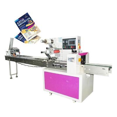 China PLC Automatic Flow Packaging Machine With Card Issuing Poster Packing Machinery for sale
