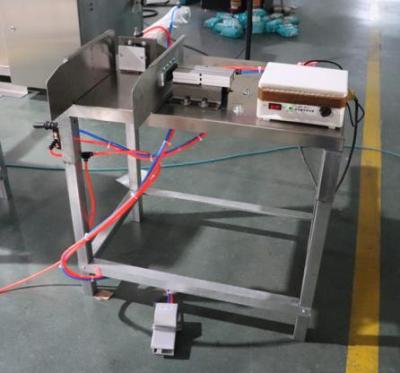 China Small Footprint Pedal Operated Paper Napkin Family Pack Semi-automatic Outer Plastic Film Sealing Machine for sale