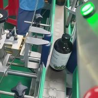 China Vertical Adhesive Labeling Machine Fully Automatic Round Bottle Labeling Machine for sale