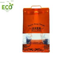 China Hot Selling Custom Orange PE 8 Side Seal Bag 500g Super Strong Odor Proof Stand for Fruits Vegetables Secure for Sushi Custom for sale