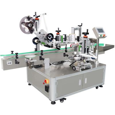 China Automatic Double Sides Labeling Machine for Square Flat Bottles 60 Bottles Per Minute for sale