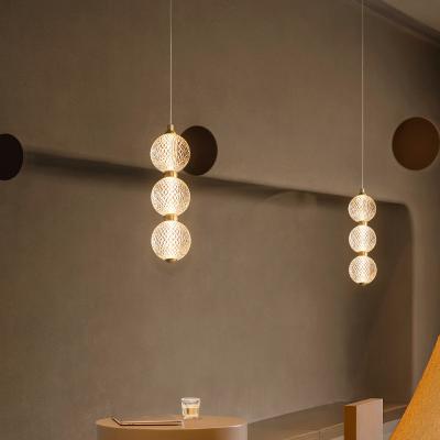 China Modern Style Acrylic And Brass Chandelier For Homes And Commercial Spaces for sale