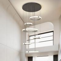 China Nordic Indoor Villa Big Lighting Chandelier Modern Creative Ring Hollow Rotating Pendant Light for sale