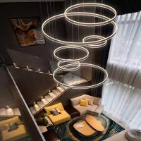 China Hotel Villa Stairs High Ceiling Hanging Black Coffee Gold Round Circle Ring Led Chandelier Pendant Light for sale
