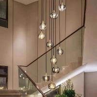 China Chocolate All Copper Staircase Pendant Lamp End Villa Living Room Light with Luxury Crystal and Rotating Function for sale