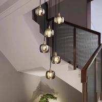 China Chocolate All Copper Staircase Pendant Lamp End Villa Living Room Light with Luxury Crystal and Rotating Function for sale