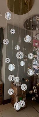 China Villa Hotel Loft Staircase Hanging Light Fixture Design Modern Acrylic Corrugated Ball Pendant Lamp With LED Light Strip for sale