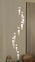 China Duplex Long Chandelier Staircase Fashion Light Luxury Simple Postmodern Creative Rotating Loft Art Hollow Living Room Light for sale