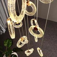 China Modern Villa Apartment Living Room Crystal Long Staircase Pendant Lamp With Three Colors Changing Light And Simple Light Luxury Ring for sale