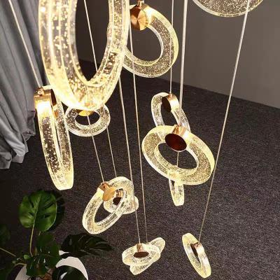 China Modern Villa Apartment Living Room Crystal Long Staircase Pendant Lamp With Three Colors Changing Light And Simple Light Luxury Ring for sale