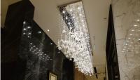 China Custom Hotel Lobby Chandelier Petal Pendant Rectangular Crystal String Creative LED Crystal Ceiling Chandelier for sale