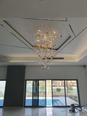 China Contemporary Decoration Lamp Hotel Lobby Hanging Design Led Pendant Light Luxury High Ceiling Maple Leaf Chandelier for sale