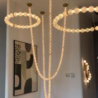 China Long Necklace Marble Beads Connector Pendant Lamp Buddhist Prayer Beads Decoration Duplex Staircase Big Chandelier Light for sale