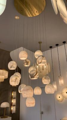 China Ball Horizontal Oval Stone Alabaster Restaurant Pendant Light Staircase Creative Art Linear LED Marble Globe Cluster Chandelier for sale