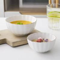 China Ceramic tableware bone dinnerware crafted from natural materials with bright glaze and unique scalloped wave edge design for sale