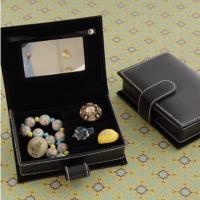 China Luxury Leather Travel Jewelry Case Portable Travel Book Shape Jewelry Packaging Box for sale