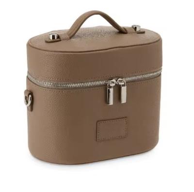 China Unisex Pu Pebble Leather Cosmetic Cases Oval Shaped Travel Makeup Bag With Insert for sale