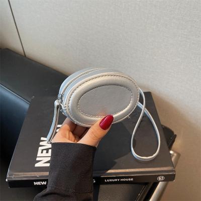 China Fashionable Oval Pu Leather Women Crossbody Bag Custom Logo Travel Lipstick Case for sale