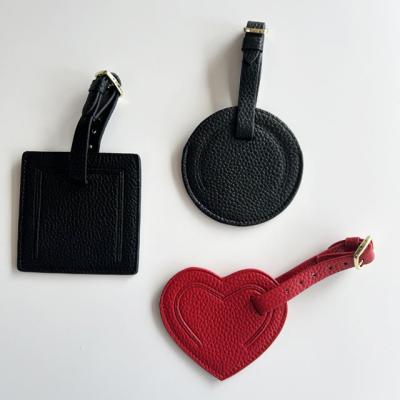 China Luxury Leather Luggage Labels Personalised Unisex Round Heart Name Id Tags Custom Design for sale