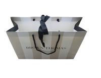 China Custom Luxury White Paper Carry Bag With Artwork Printing Manufacturers for sale