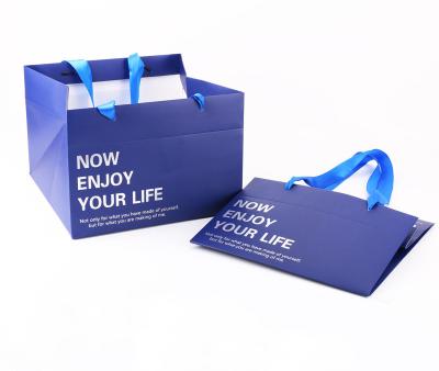 China Custom Printed Large Square Bottom Paper Carrier Bags With Satin Ribbon Handles for sale