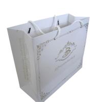 China Order Custom Printed Paper Merchandise Bag Business Packaging Online With Eyelet for sale