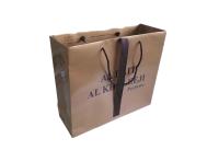 China Custom Recycled Brown Paper Merchandise Bags Wholesale With Gold Foil Logo for sale