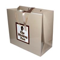 China Custom Recycled Brown Paper Merchandise Bags Wholesale With Gold Foil Logo for sale