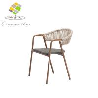China Aluminum Tube Frame Garden Outdoor Stackable Arm Chair Weather Resistant Rattan Chair for Cafe Restaurant for sale