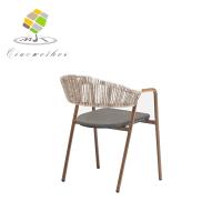 China Aluminum Tube Frame Garden Outdoor Stackable Arm Chair Weather Resistant Rattan Chair for Cafe Restaurant for sale