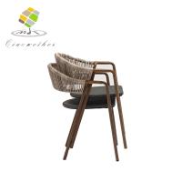 China Aluminum Tube Frame Garden Outdoor Stackable Arm Chair Weather Resistant Rattan Chair for Cafe Restaurant for sale